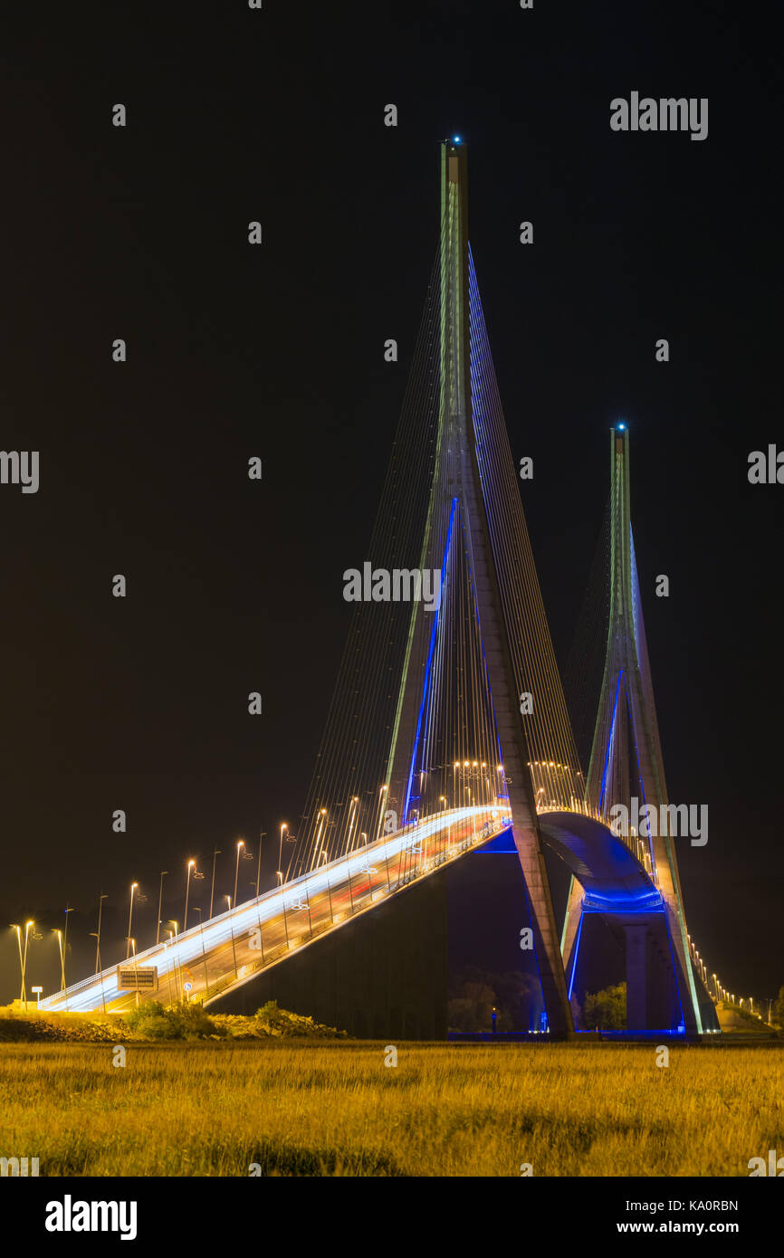Illuminated Pont de Normandy by night. Bridge over river Seine in ...