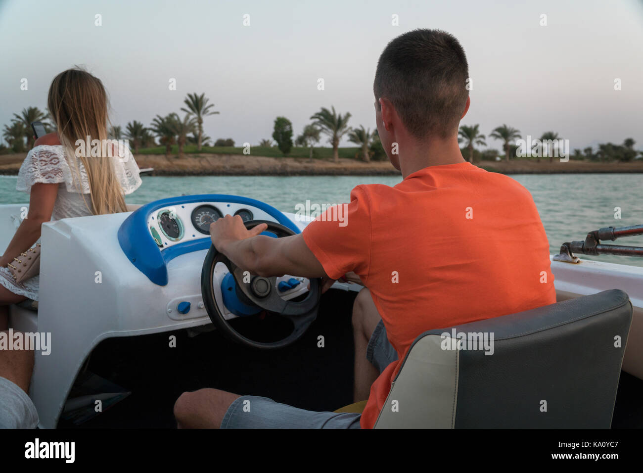 The guy drives a motor boat on the channels of the city of El Gouna ...