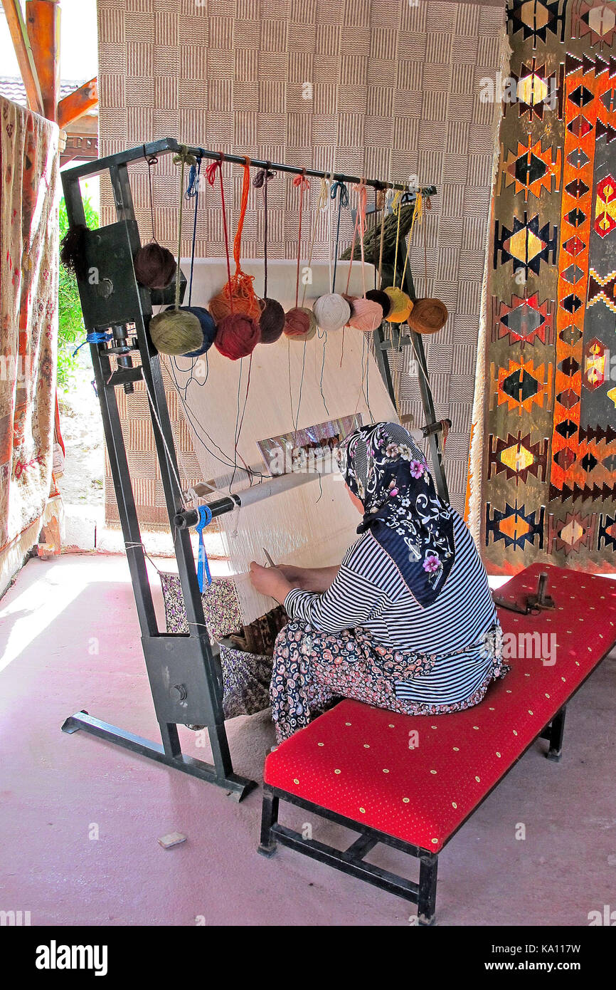 Turkish woman weaving carpets In Dalyan Stock Photo - Alamy