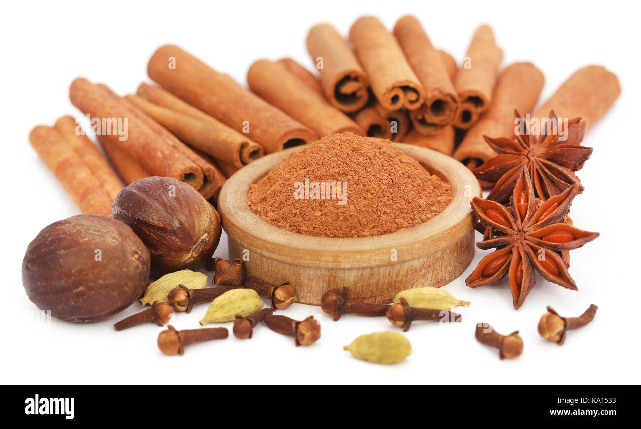Aromatic cinnamon with star anise and other spices over white ...