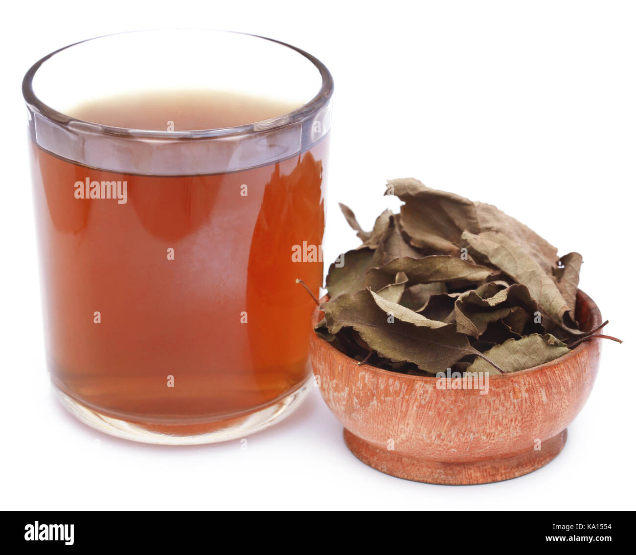 Herbal tea with tulsi leaves over white background Stock Photo - Alamy