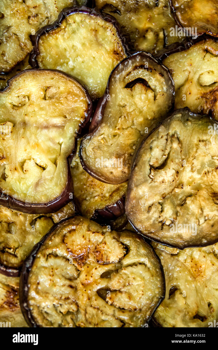 Fried and cooked aubergine with garlic in olive oil Stock Photo - Alamy