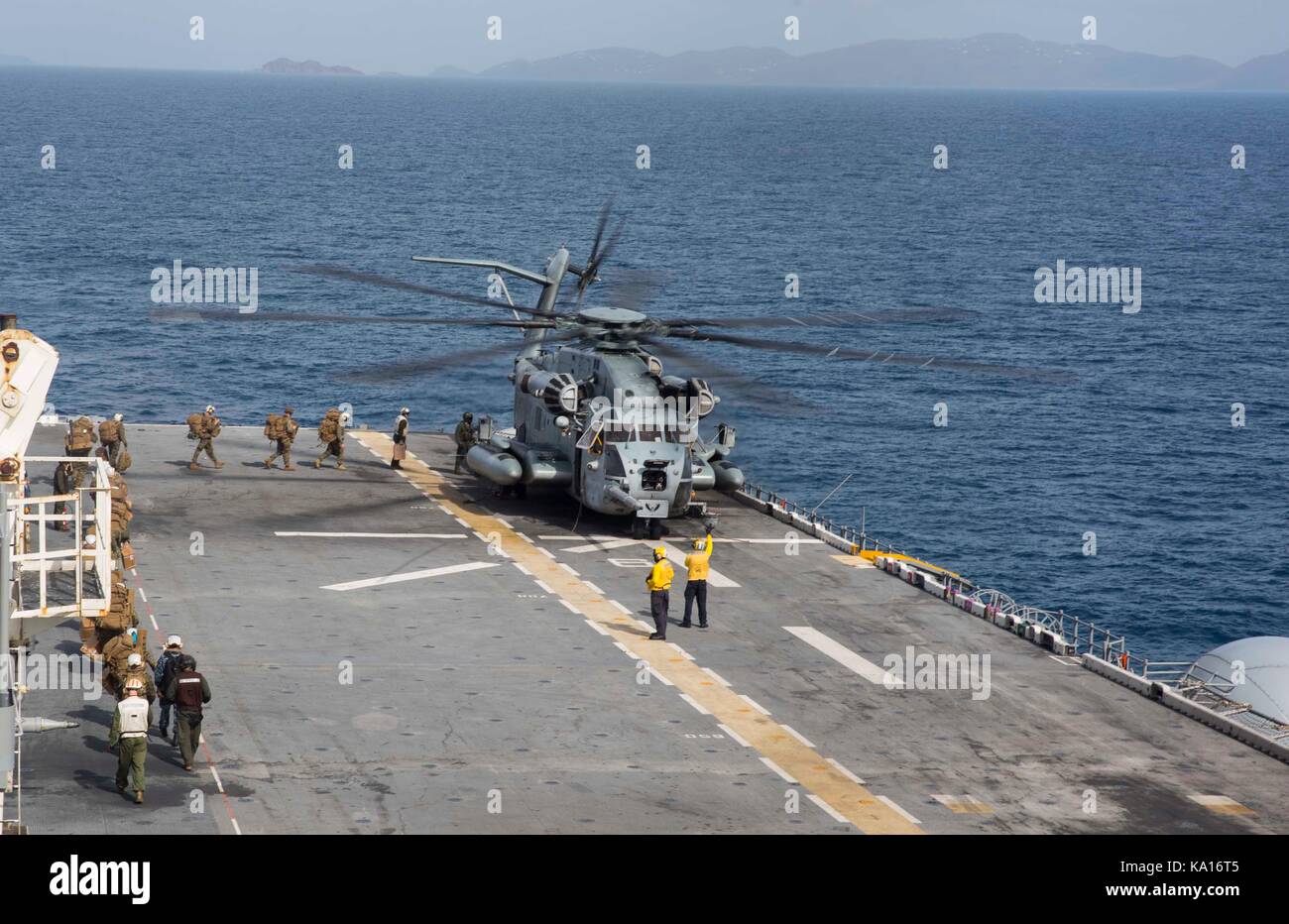 A U.S Marine Corps CH-53E Super Stallion helicopter transports Marines ...