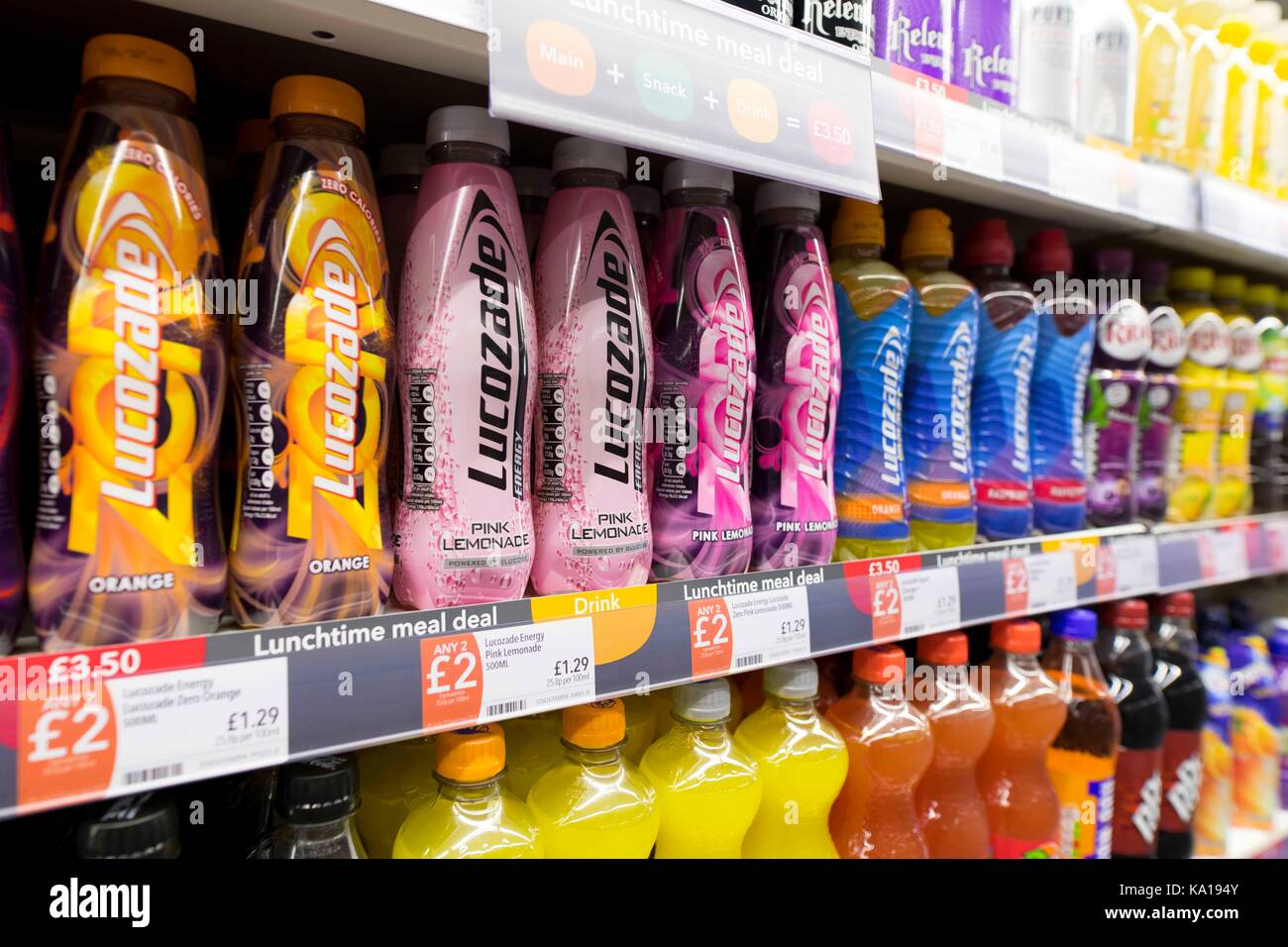 Fizzy drinks on display on a supermarket shelf Stock Photo - Alamy