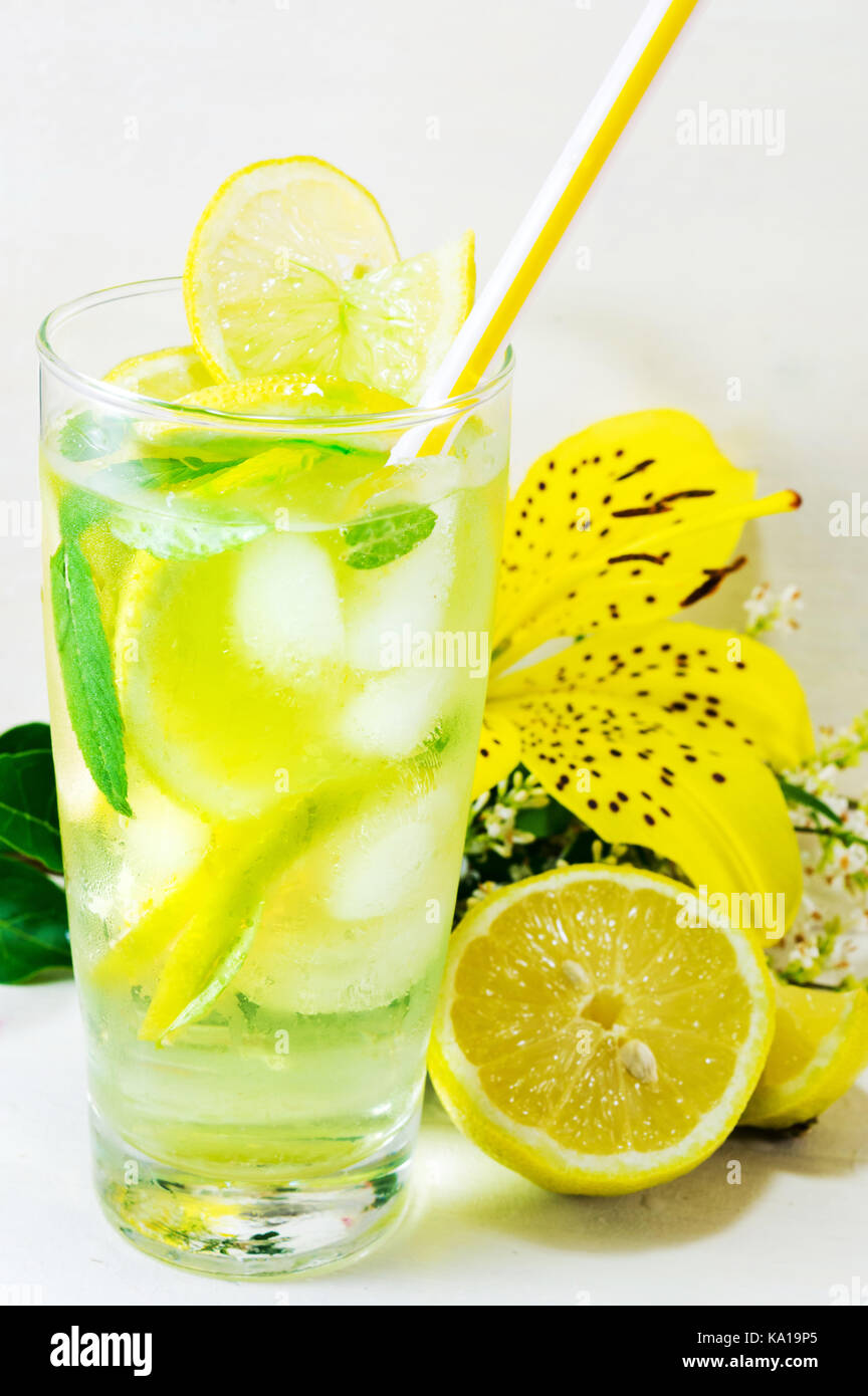 Lemonade with mint leafs and ice in a glass Stock Photo - Alamy