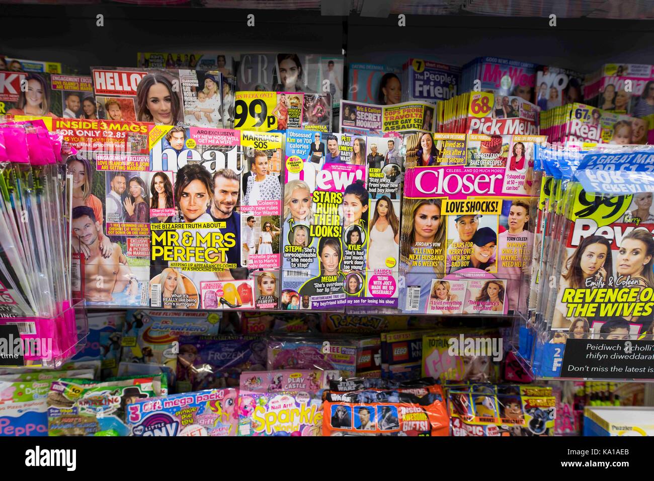 Magazines on display in a newsagent store Stock Photo - Alamy