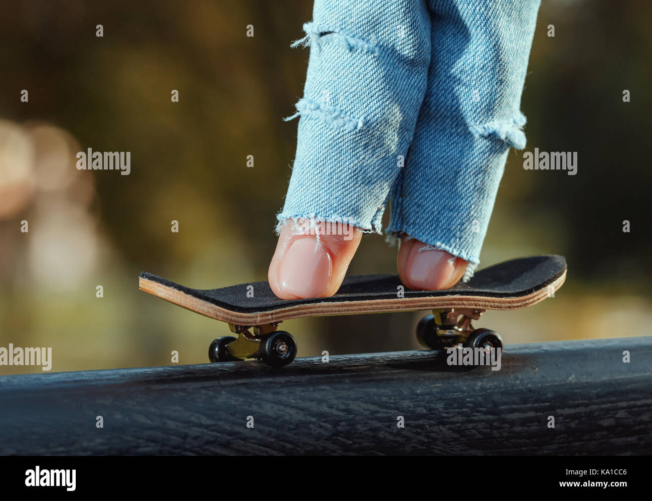 Skating on the fingerboard, training process. Closeup Stock Photo - Alamy