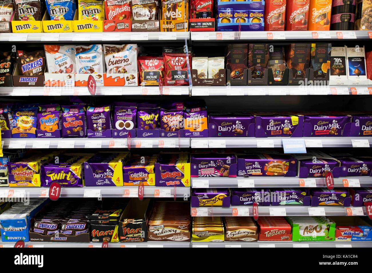 Chocolates and snacks on display in a supermarket shop Stock Photo - Alamy