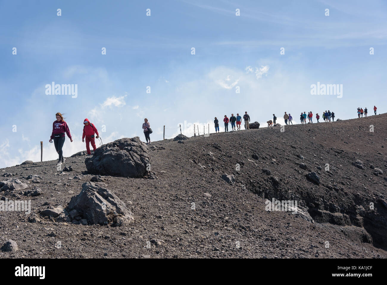 Etna, Sicily, Italy - August 21, 2017: People walk around the crater of ...