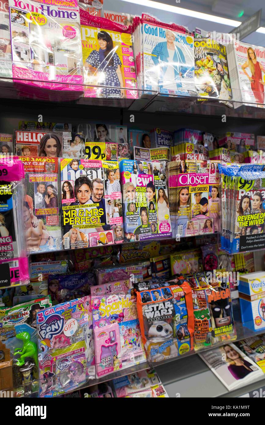 Magazines on display in a newsagent store Stock Photo - Alamy