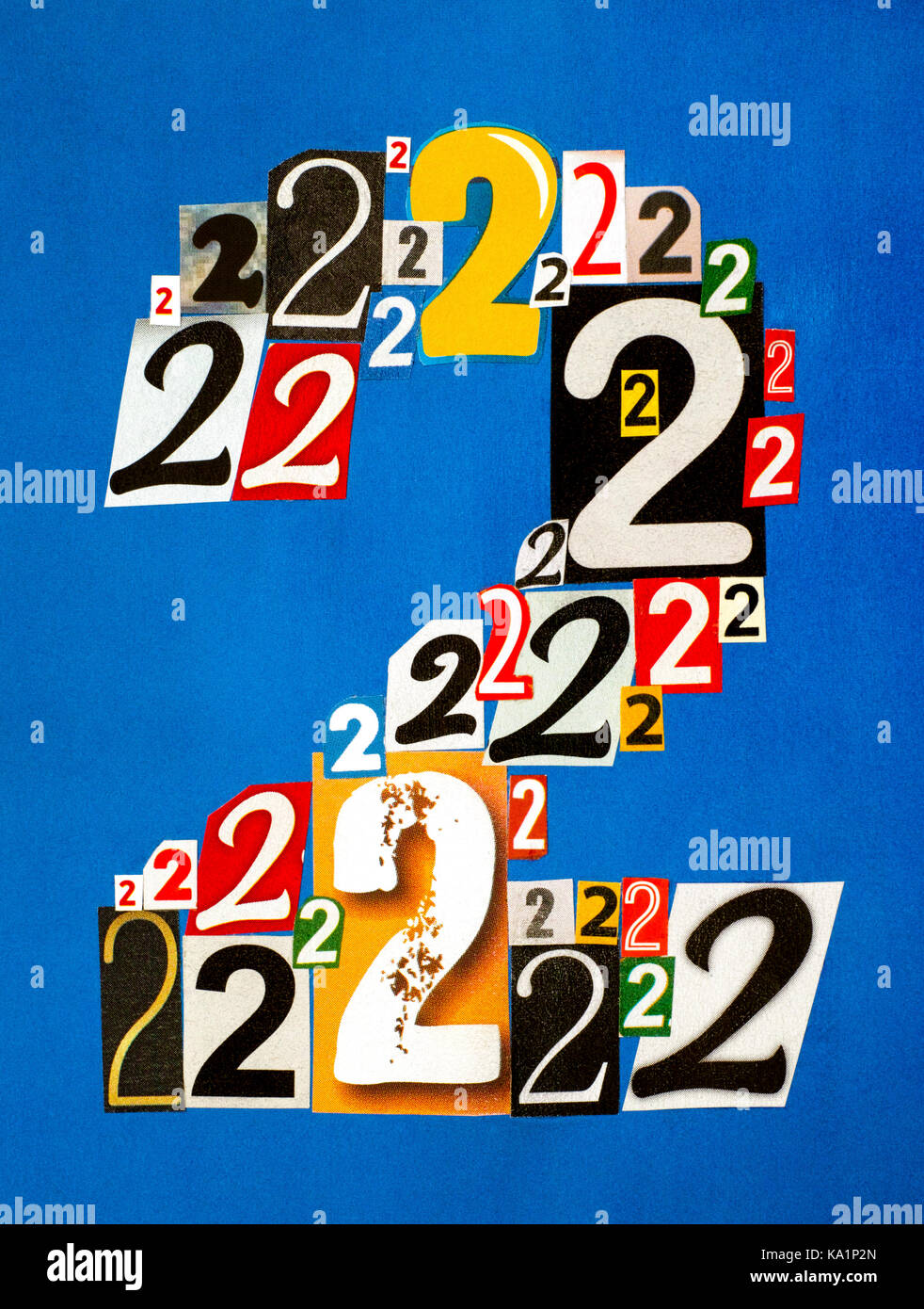 Number Two made from numbers cutting from magazines on blue background ...