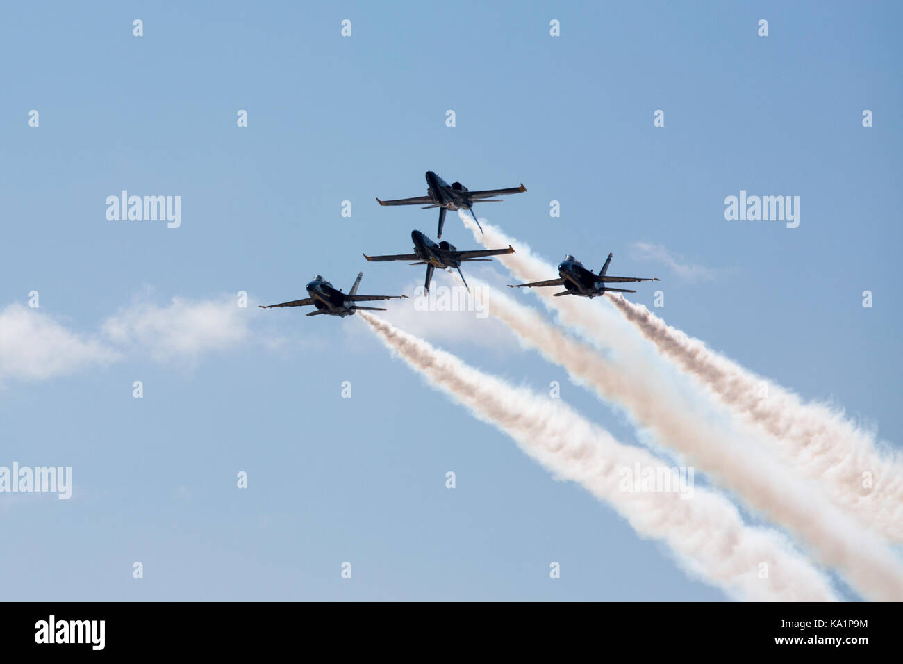 The U.S. Navy Blue Angels perform an inverted flight maneuver during ...