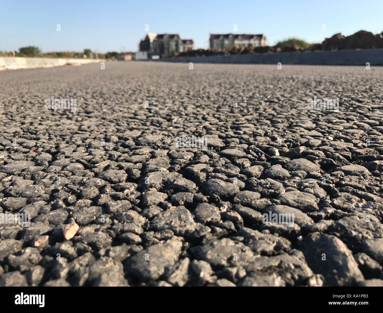 Rough asphalt pavement in the summer season Stock Photo - Alamy