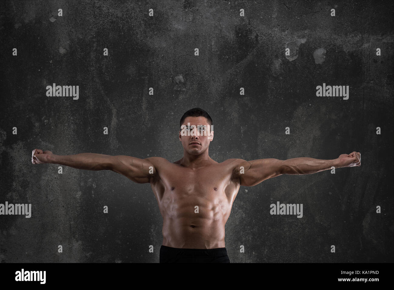 Muscular of a body building trainer Stock Photo - Alamy