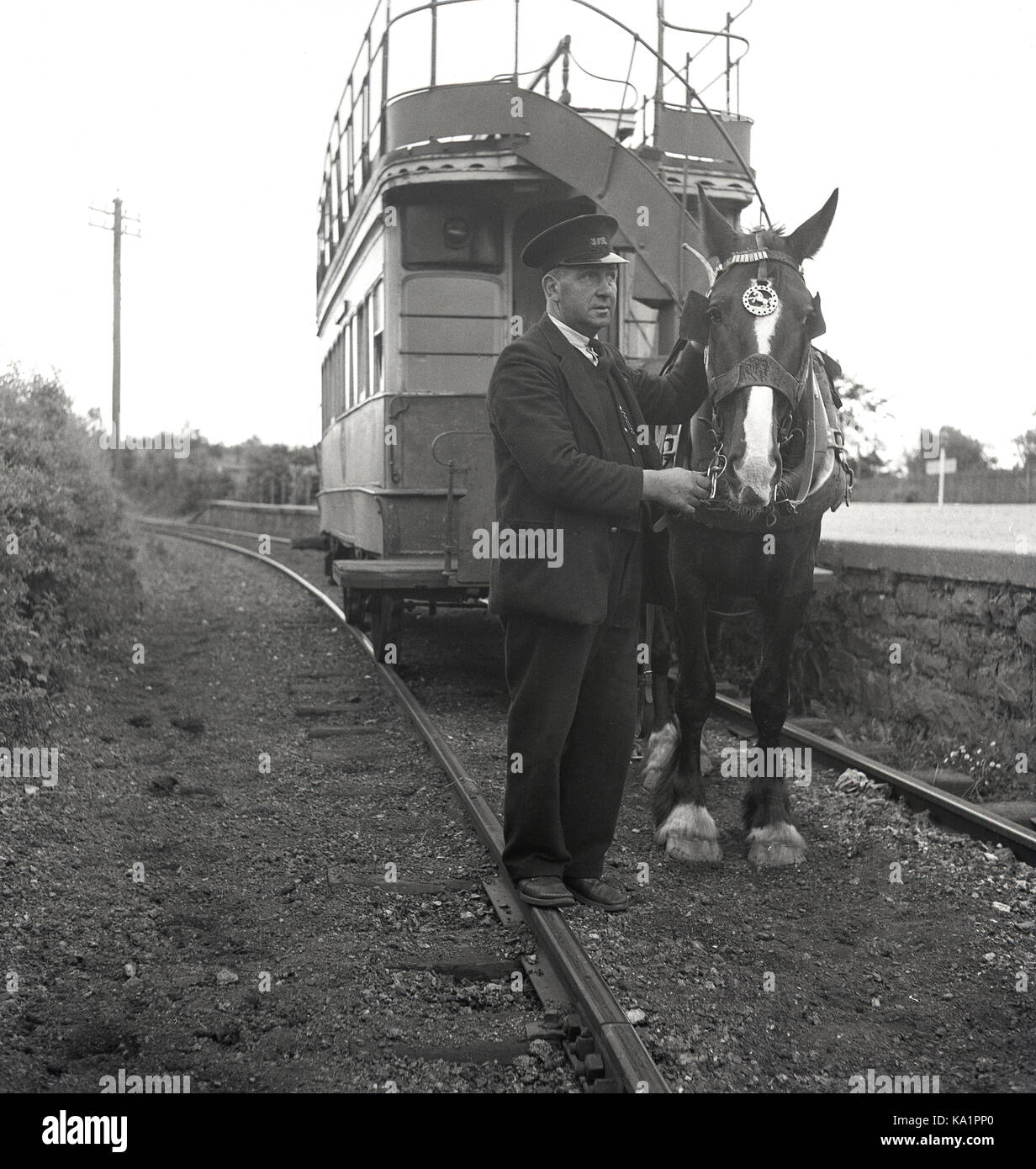 1950s, historical, outside standing on a rail track, a uniformed ...