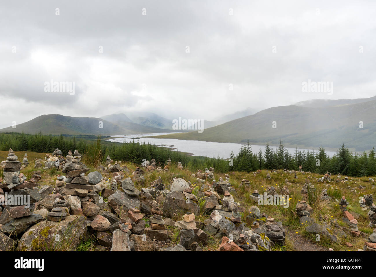 Piles of stones in Loch Loyne along A87 road, Scotland, UK Stock Photo ...