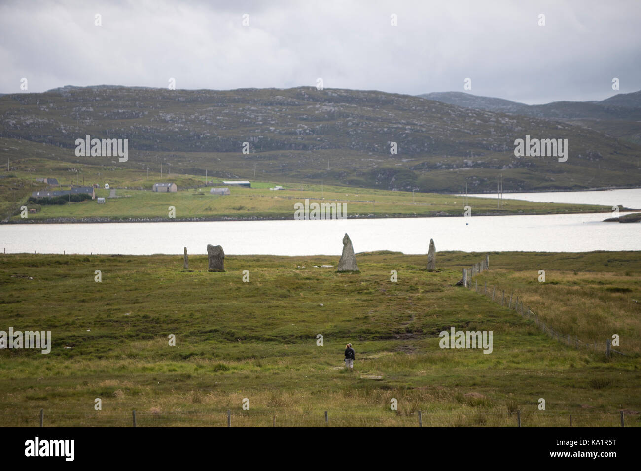 Two tourists walking to Callanish II from Callanish III, stone circle ...