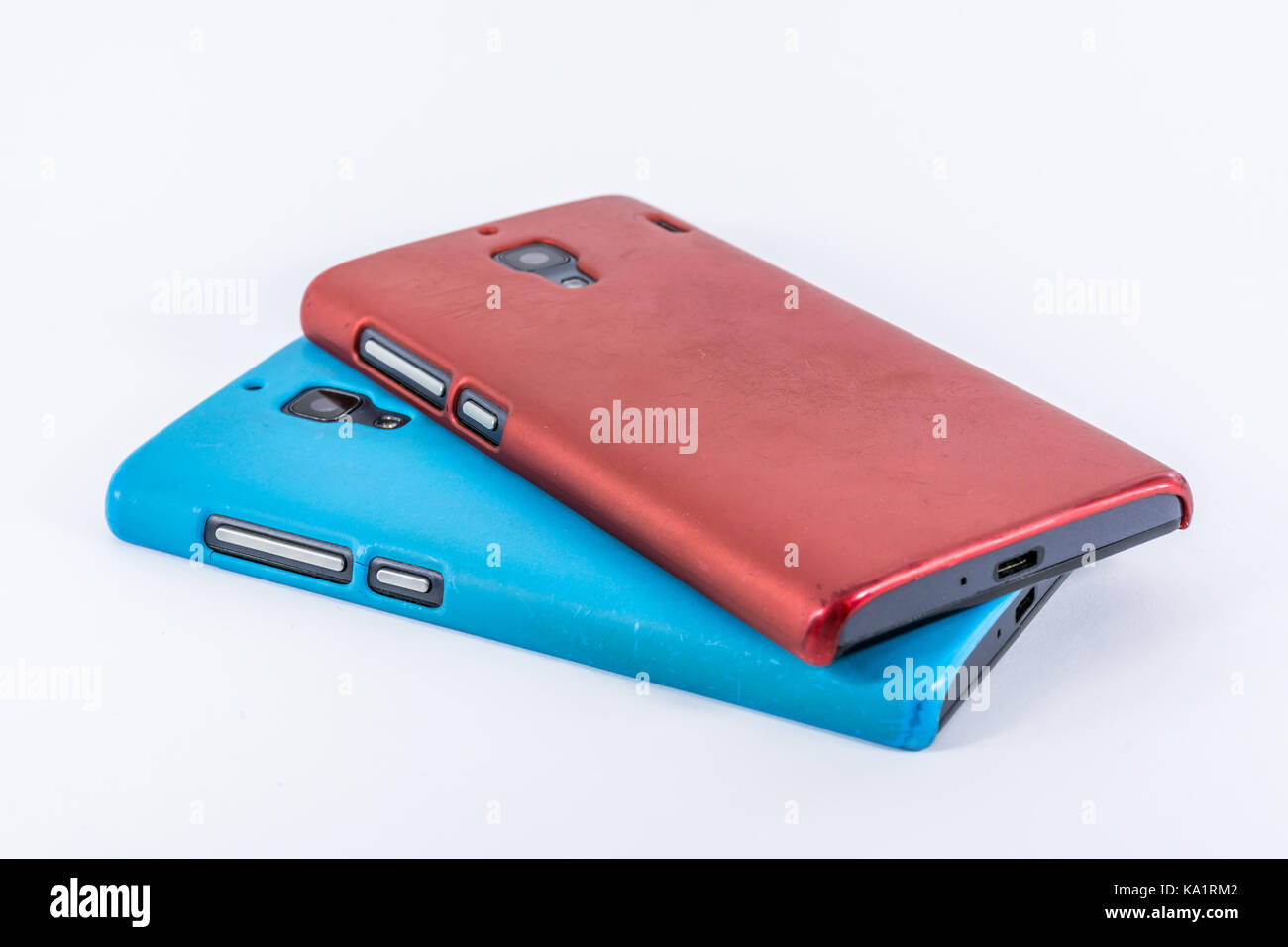 Smartphones with blue and red cover isolated on white background Stock ...