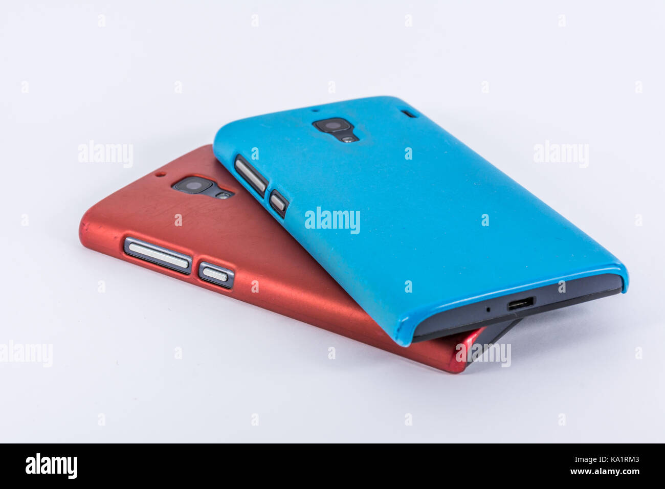Smartphones with red and blue cover isolated on white background Stock ...