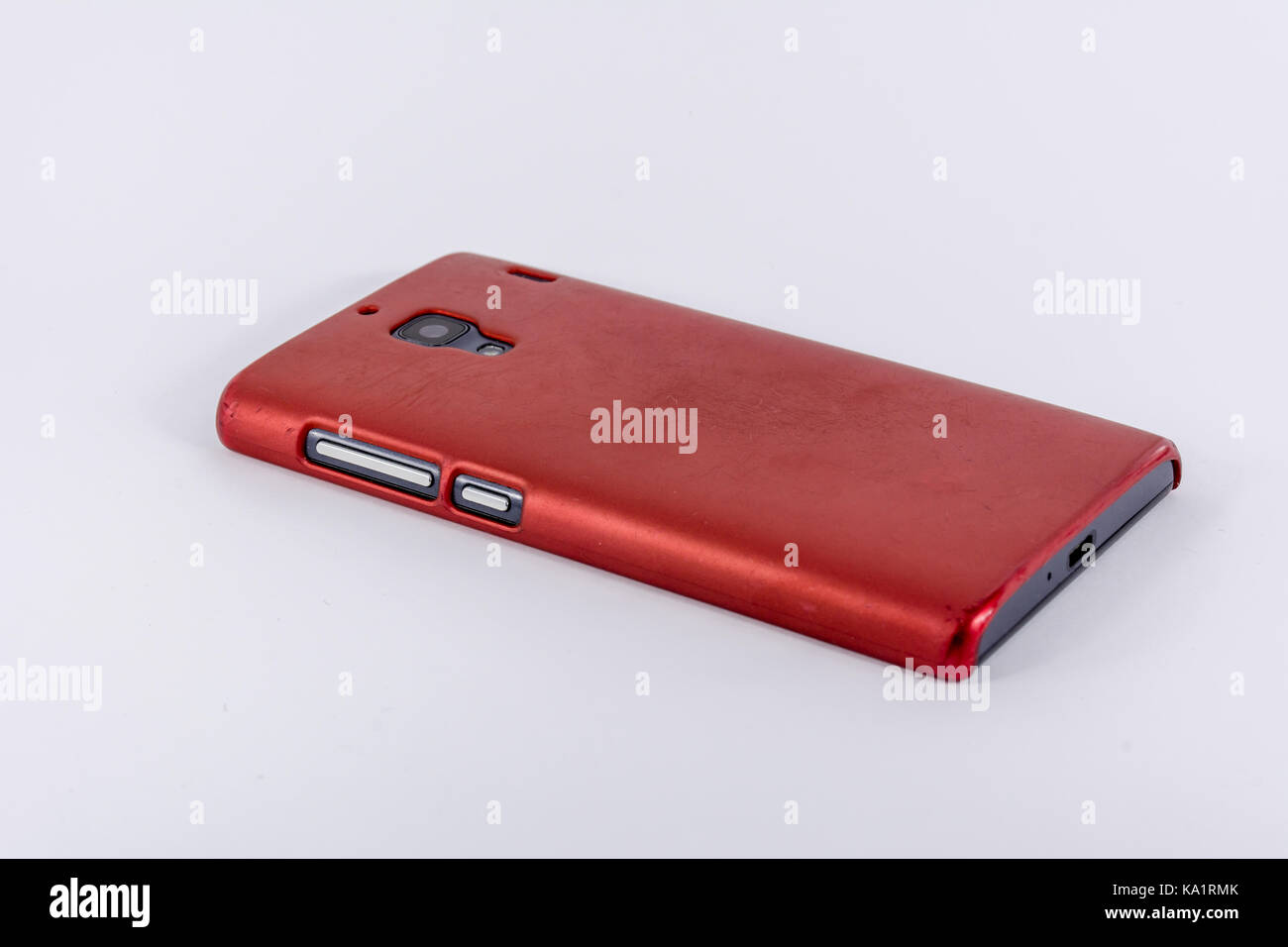 Smartphone with red cover isolated on white background Stock Photo - Alamy