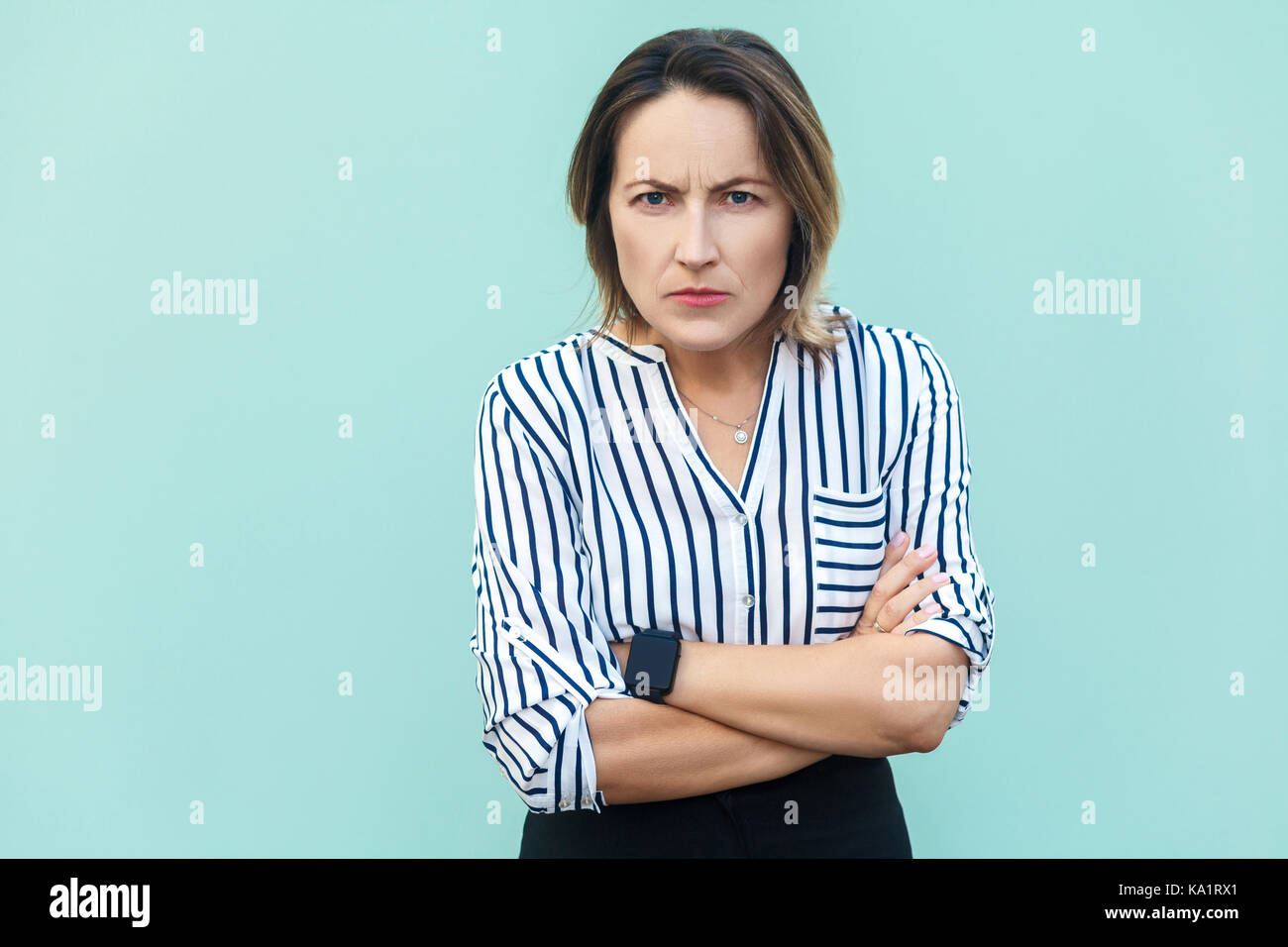 Angry, aggressive. Handsome elegant woman looking at camera with angry ...