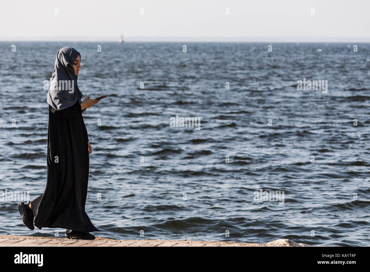 Muslim girl walking hi-res stock photography and images - Alamy