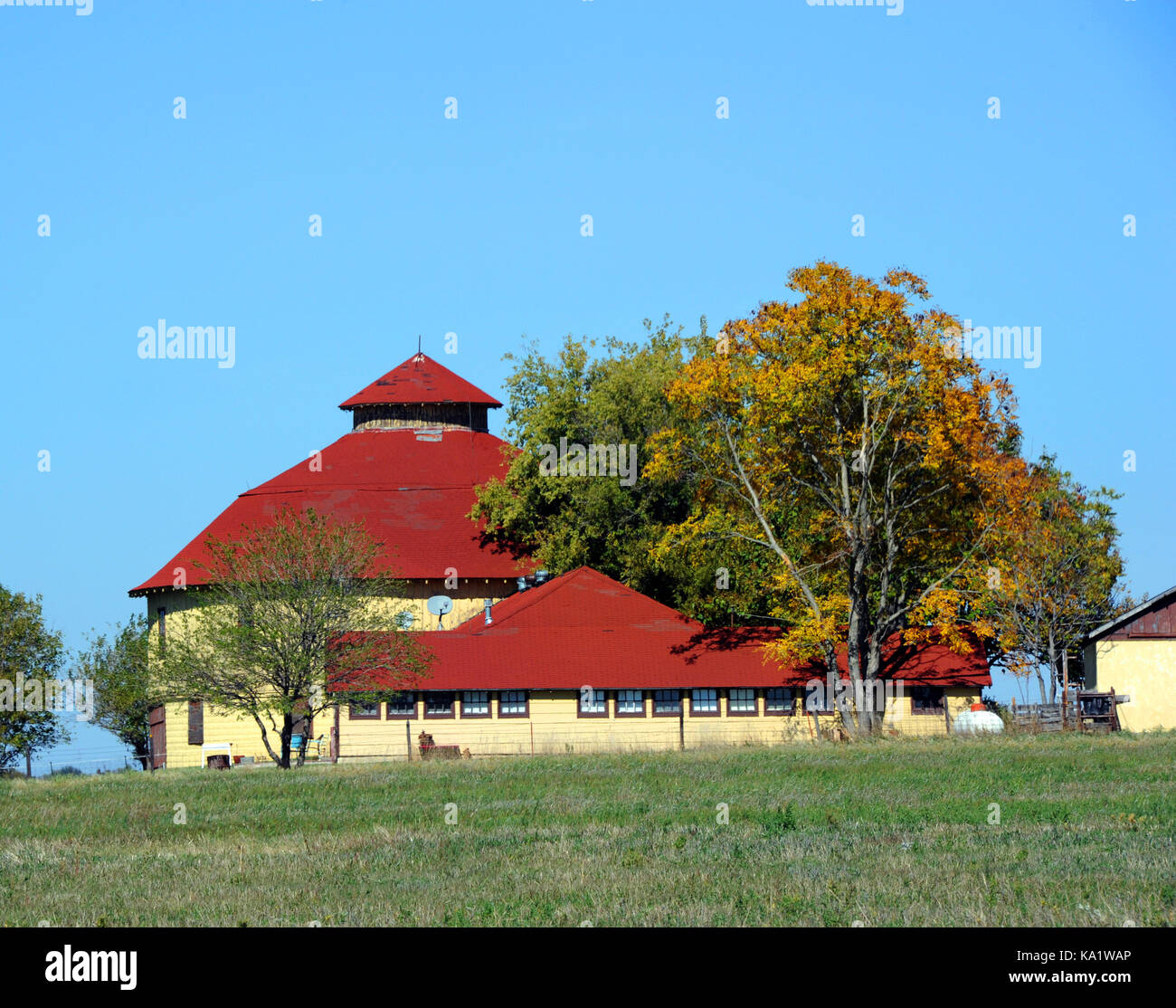 Round barn outside of Derby, Kansas has red shingles and wooden ...