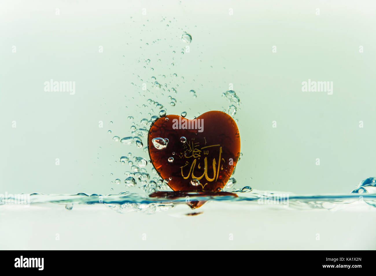 "Allah" god of Islam with ( symbol ) Water splash with bubbles of air ...