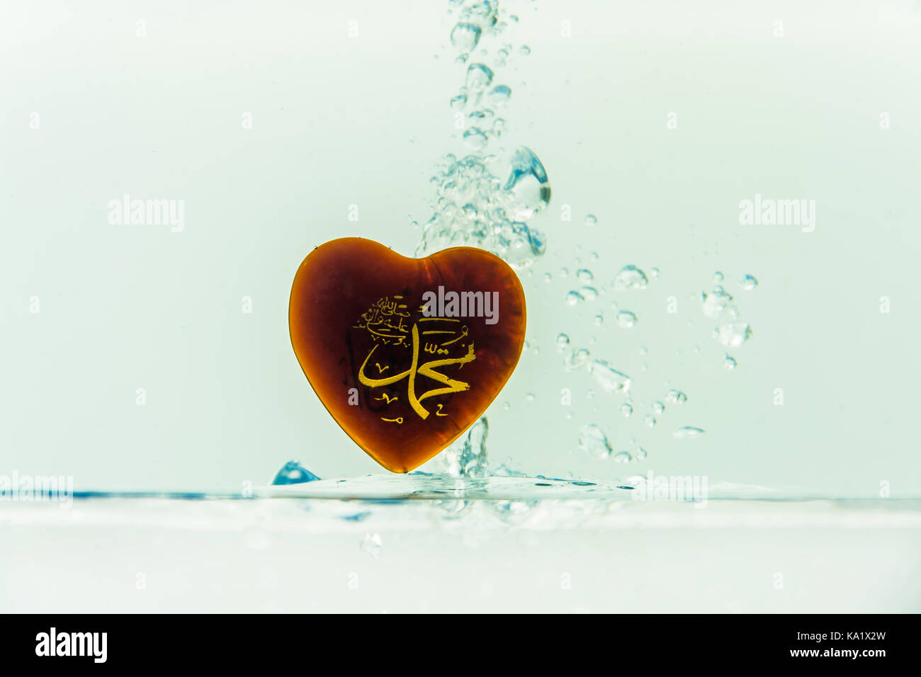 "Muhammad " prophet of Islam ( symbol ) Water splash with bubbles of ...