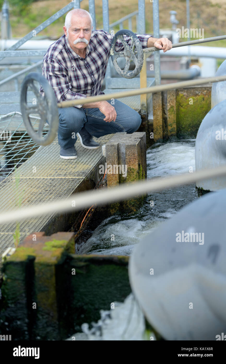man working in a water treatment plant Stock Photo - Alamy