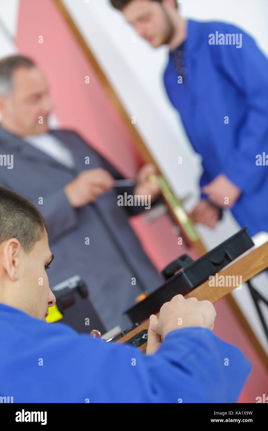 apprentice engineers working on factory floor Stock Photo - Alamy