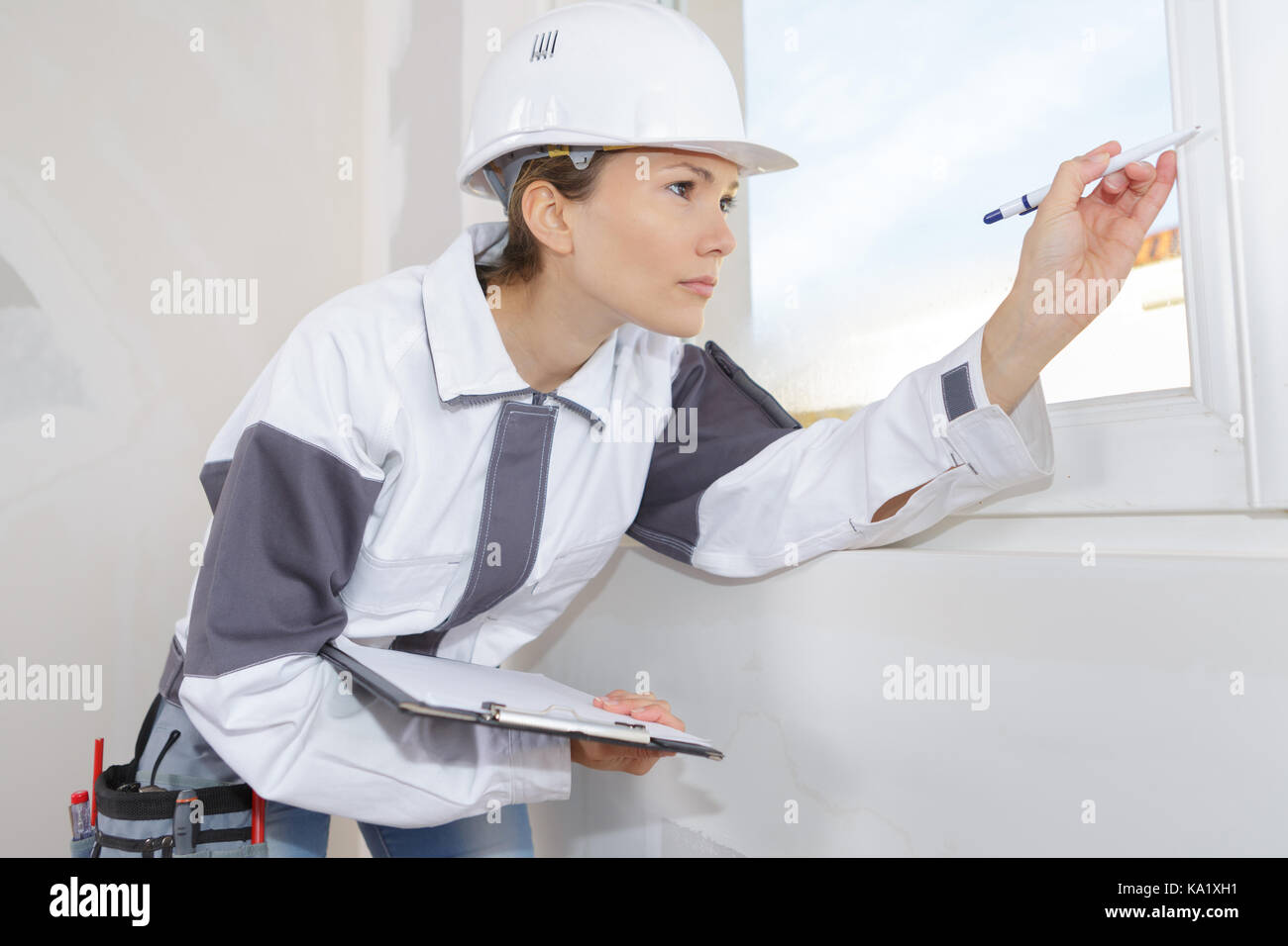 window setter inspecting the window Stock Photo - Alamy