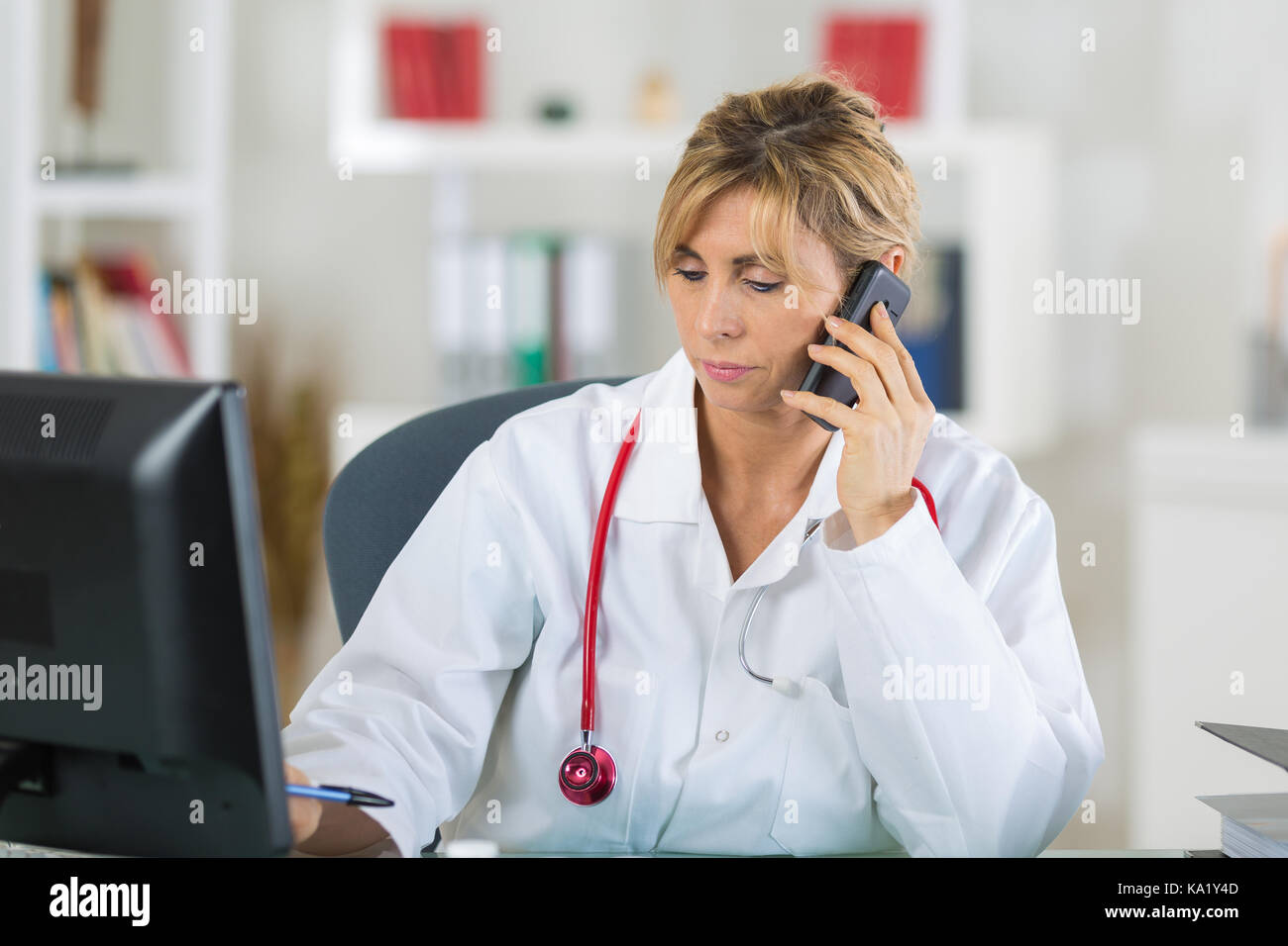 doctor with phone Stock Photo - Alamy