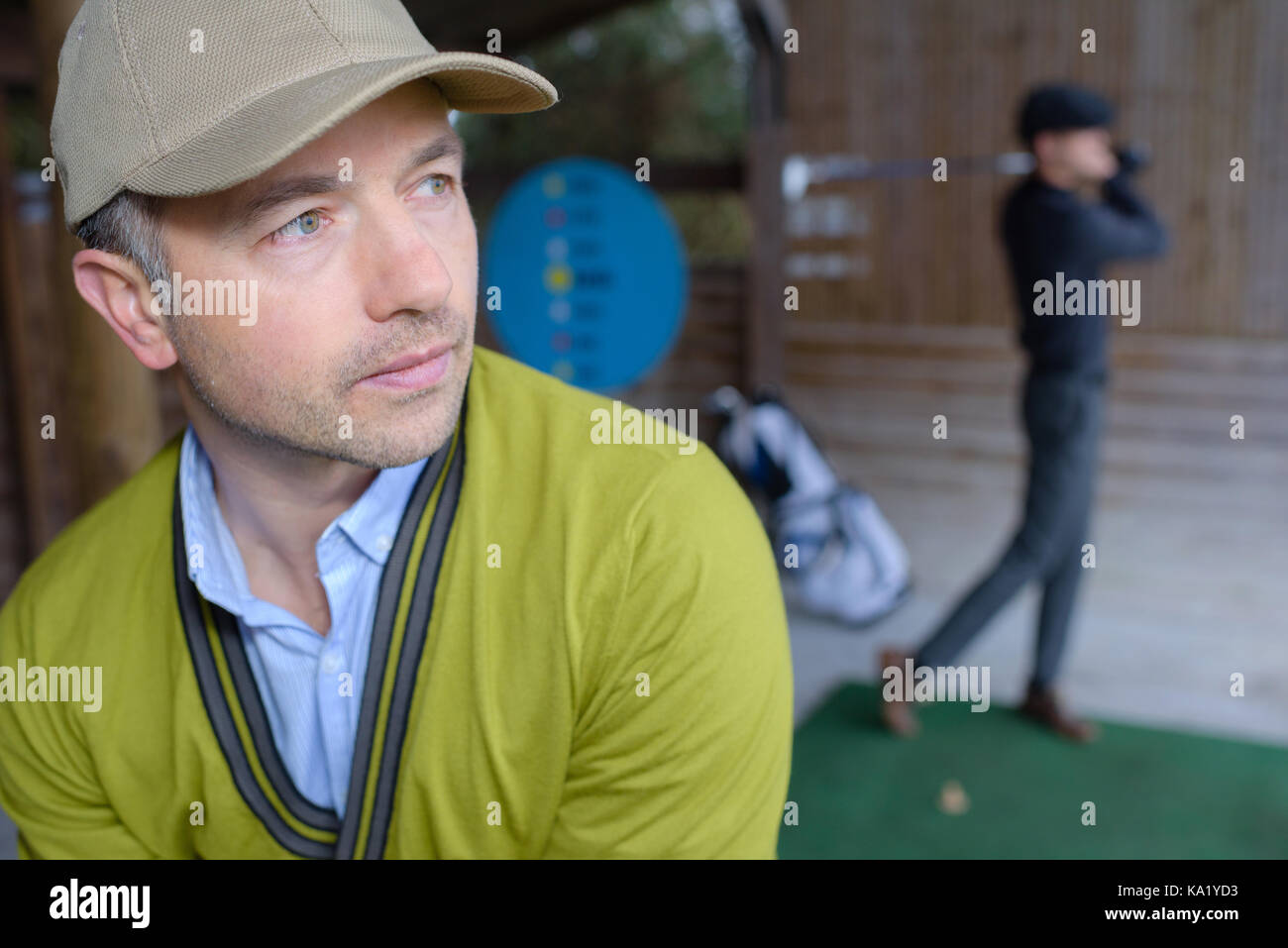 friends playing golf inside while having fun together Stock Photo - Alamy