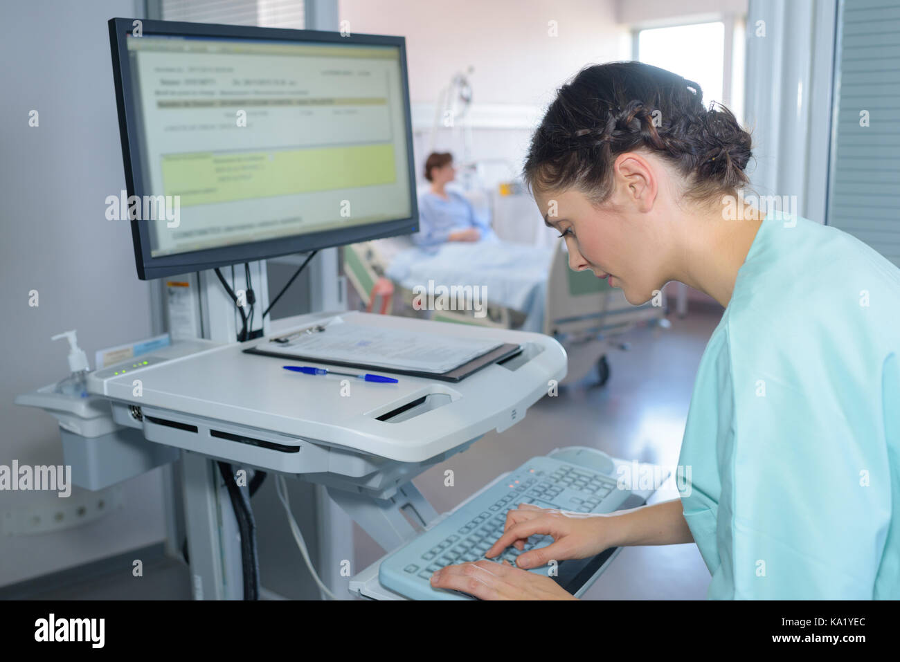 nurse entering prescription details onto a computer Stock Photo - Alamy