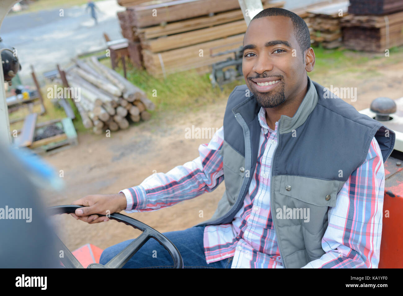 worker in a wood construction site Stock Photo - Alamy
