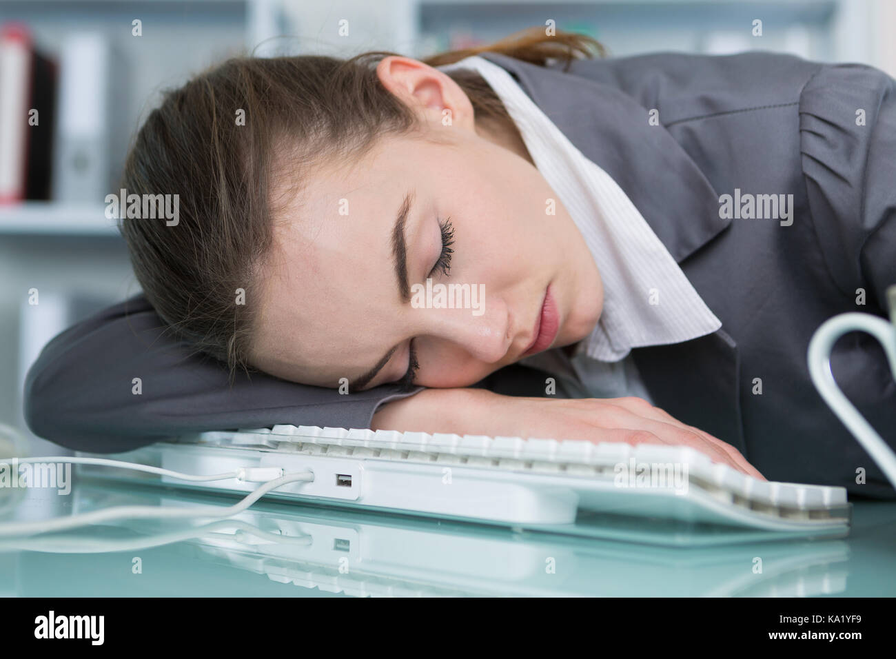 tired woman at work in the office Stock Photo - Alamy