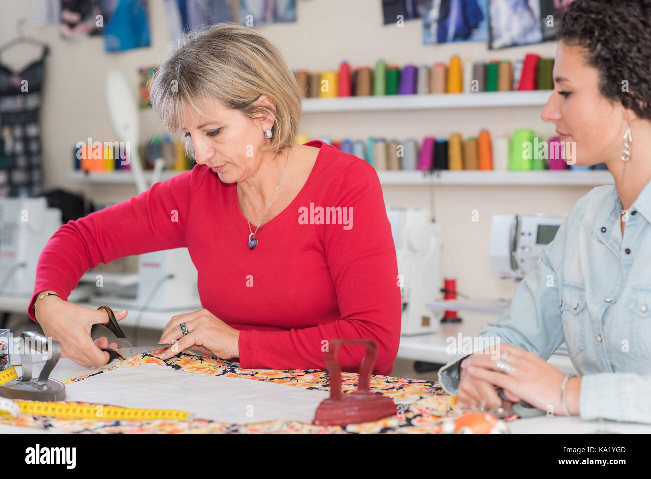 dressmaker at work making patterns of fabric Stock Photo - Alamy