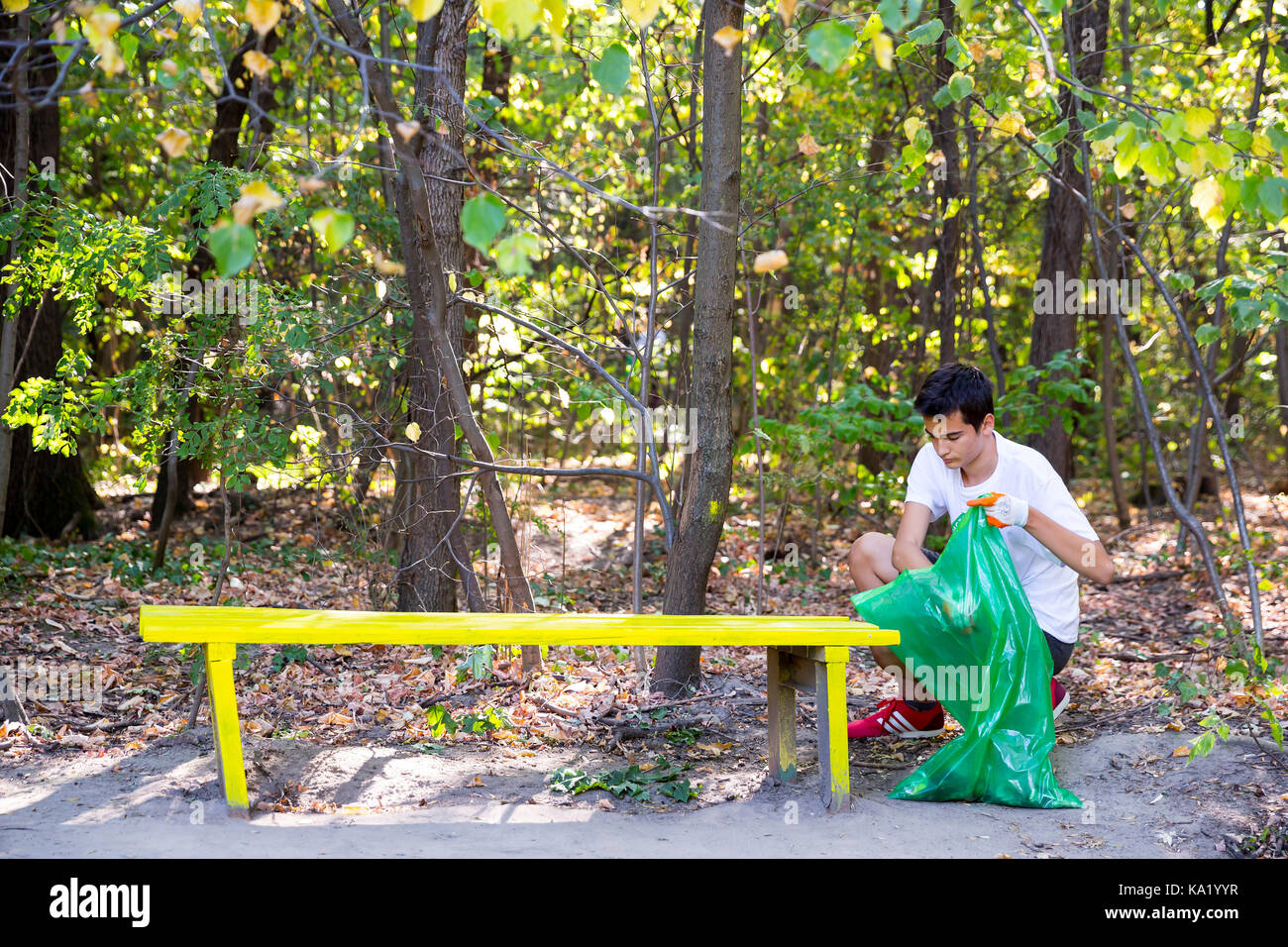 Sofia, Bulgaria - 16 September, 2017: Young man picks up trash in the ...