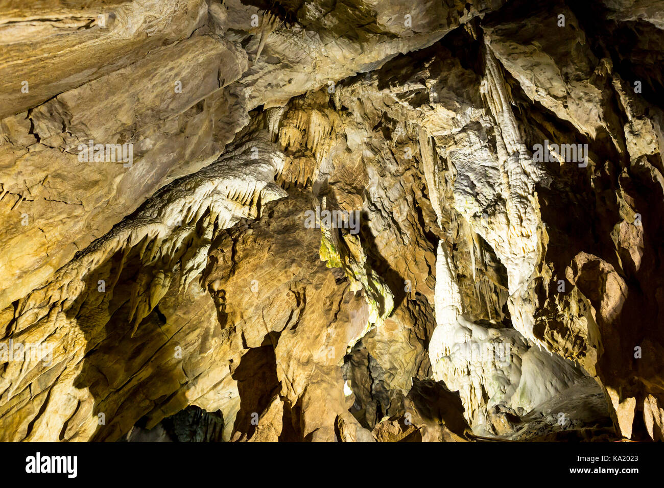 Inside of a beautiful colourful cave. Flowstones, stalactites and ...