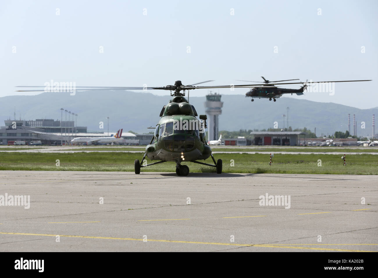 Military helicopters at the runway of the airport Stock Photo - Alamy