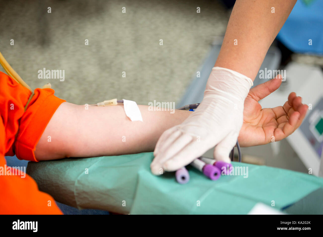The hand of a woman who donates blood. Female donor gives blood in a ...