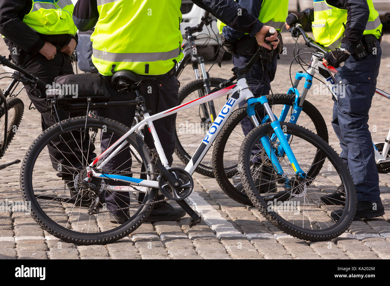 Four policemen with their bikes. Police Department bicycle cops Stock ...