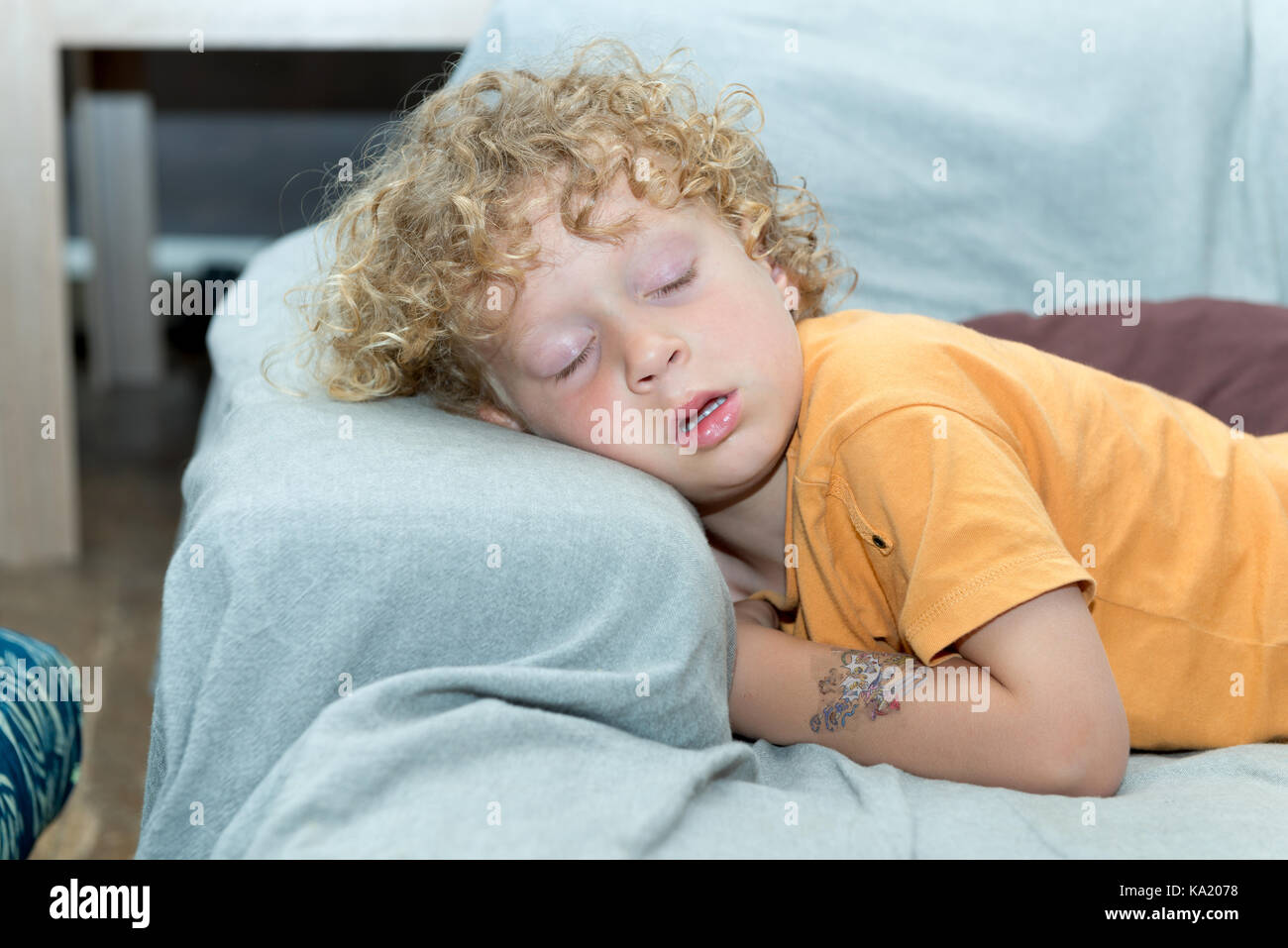 a little boy sleeping on the sofa Stock Photo - Alamy