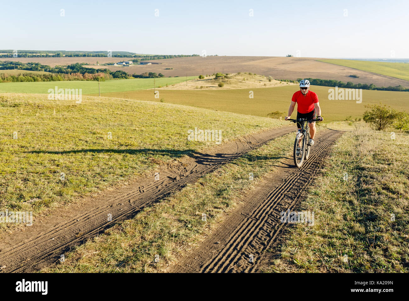 Bike adventure travel photo. Bike tourist rides on the country road ...