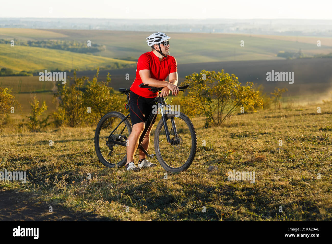 Bike adventure travel photo. Bike tourist rides on the country road ...