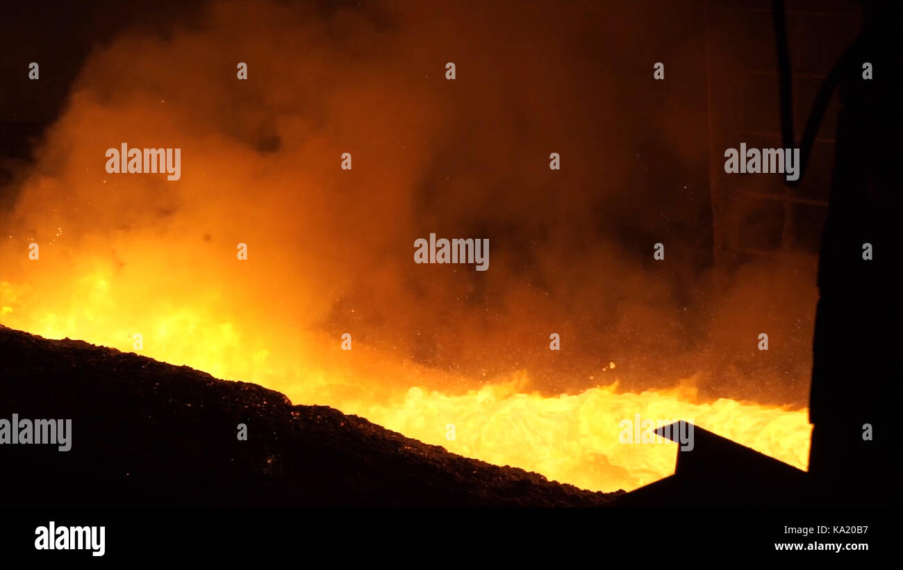 Liquid metal from blast furnace. Liquid metal pouring stream Stock ...