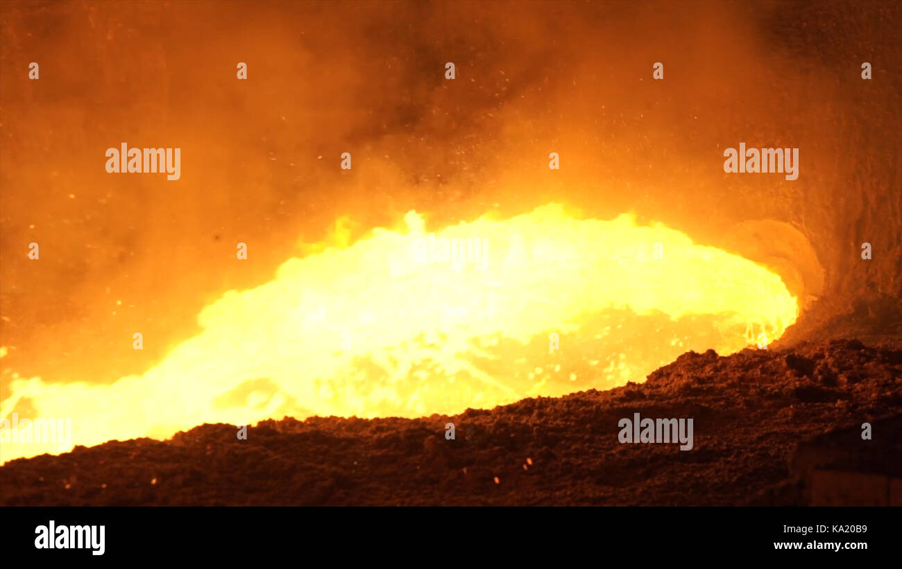 Liquid metal from blast furnace. Liquid metal pouring stream Stock ...