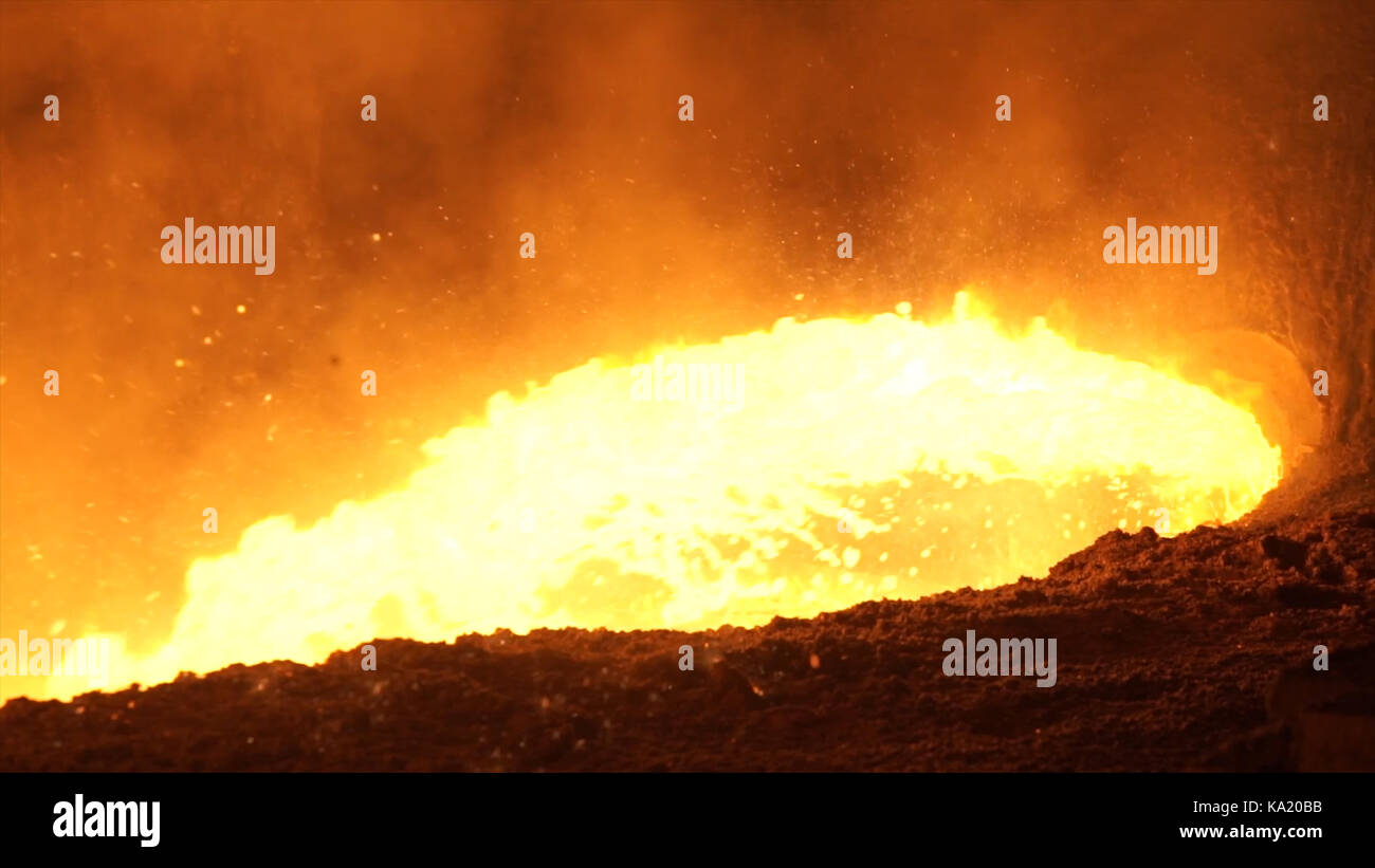 Liquid metal from blast furnace. Liquid metal pouring stream Stock ...