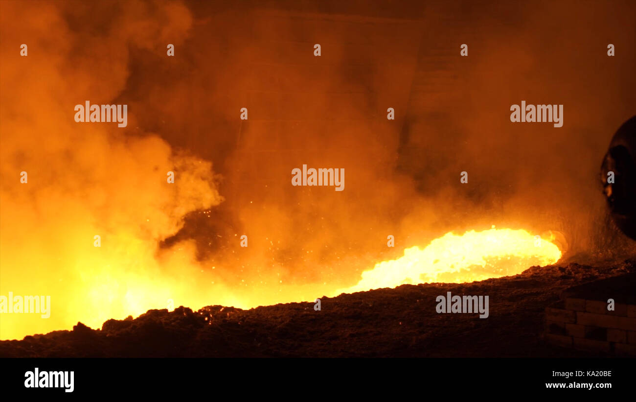 Liquid metal from blast furnace. Liquid metal pouring stream Stock ...